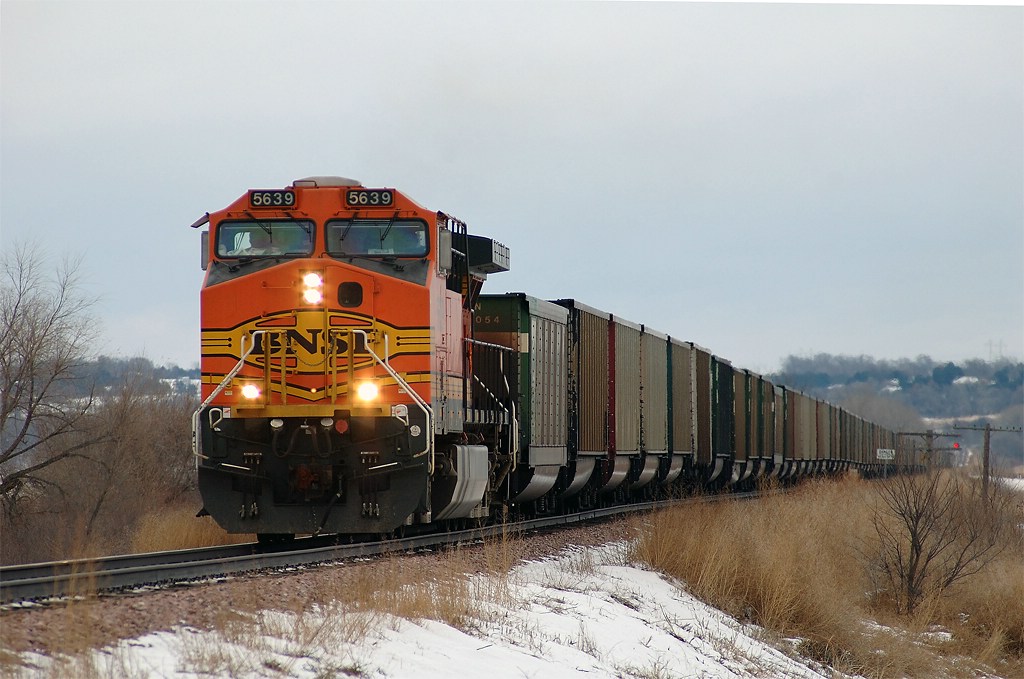 BNSF 5639, AC44CW, leads a westbound empty hopper train